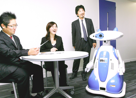 Japan `Ubiko' robots interact with people,take on human jobs - Taipei Times