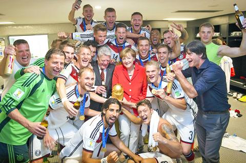 WORLD CUP: Merkel: a member of Germany team - Taipei Times