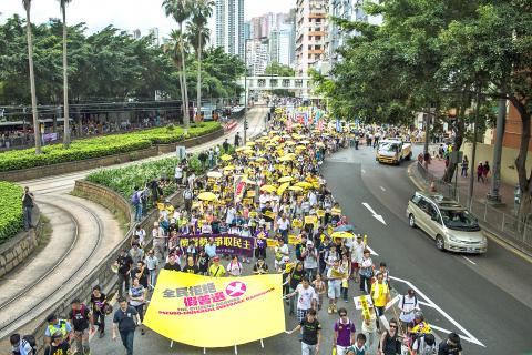Pro-democracy activists in HK protest reforms - Taipei Times