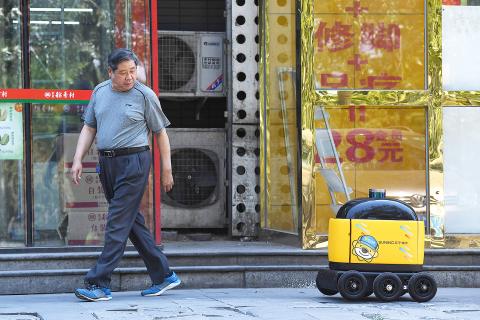 FEATURE: In China, yellow robots deliver snacks to your doorstep — at 3 ...