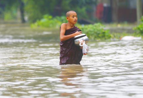 Myanmar monsoon floods force thousands to evacuate - Taipei Times