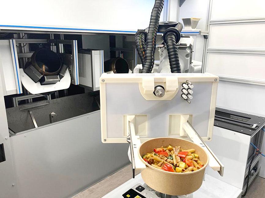 Robot cooks up new future for fast food in Riga - Taipei Times