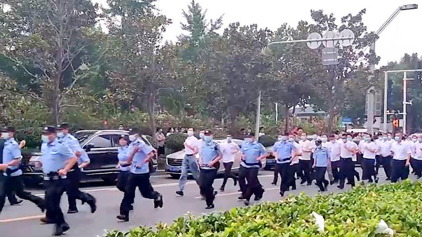 China detains ‘gang’ after protests - Taipei Times