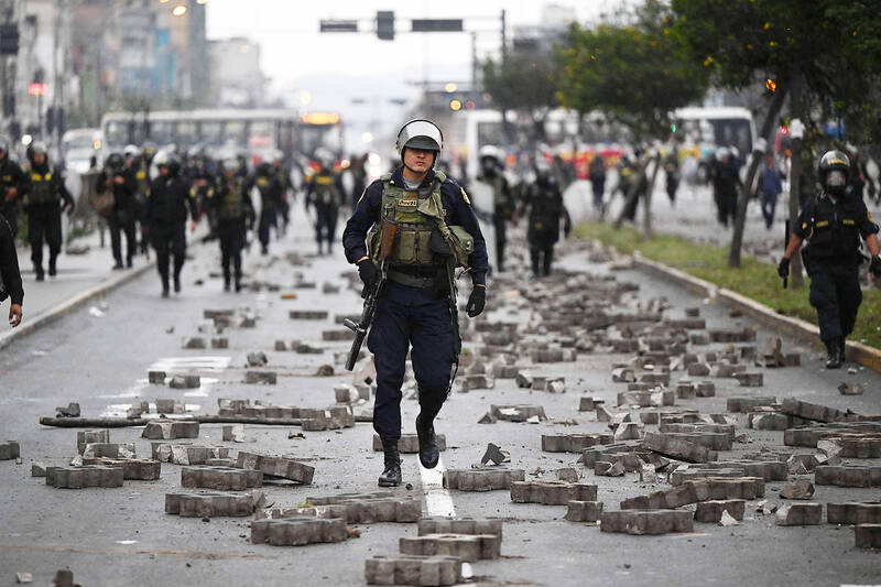 Boluarte vows to heal Peru’s wounds - Taipei Times