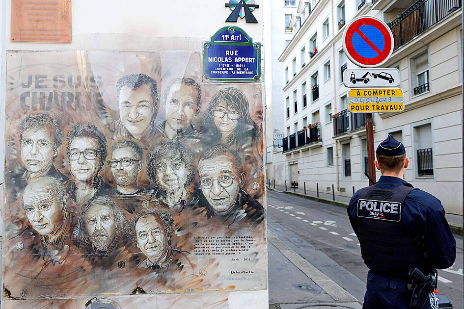 France remembers attacks as Iran rages over new cartoons - Taipei Times