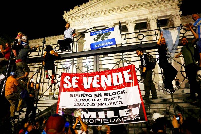 Milei launches economic policy, as people protest - Taipei Times